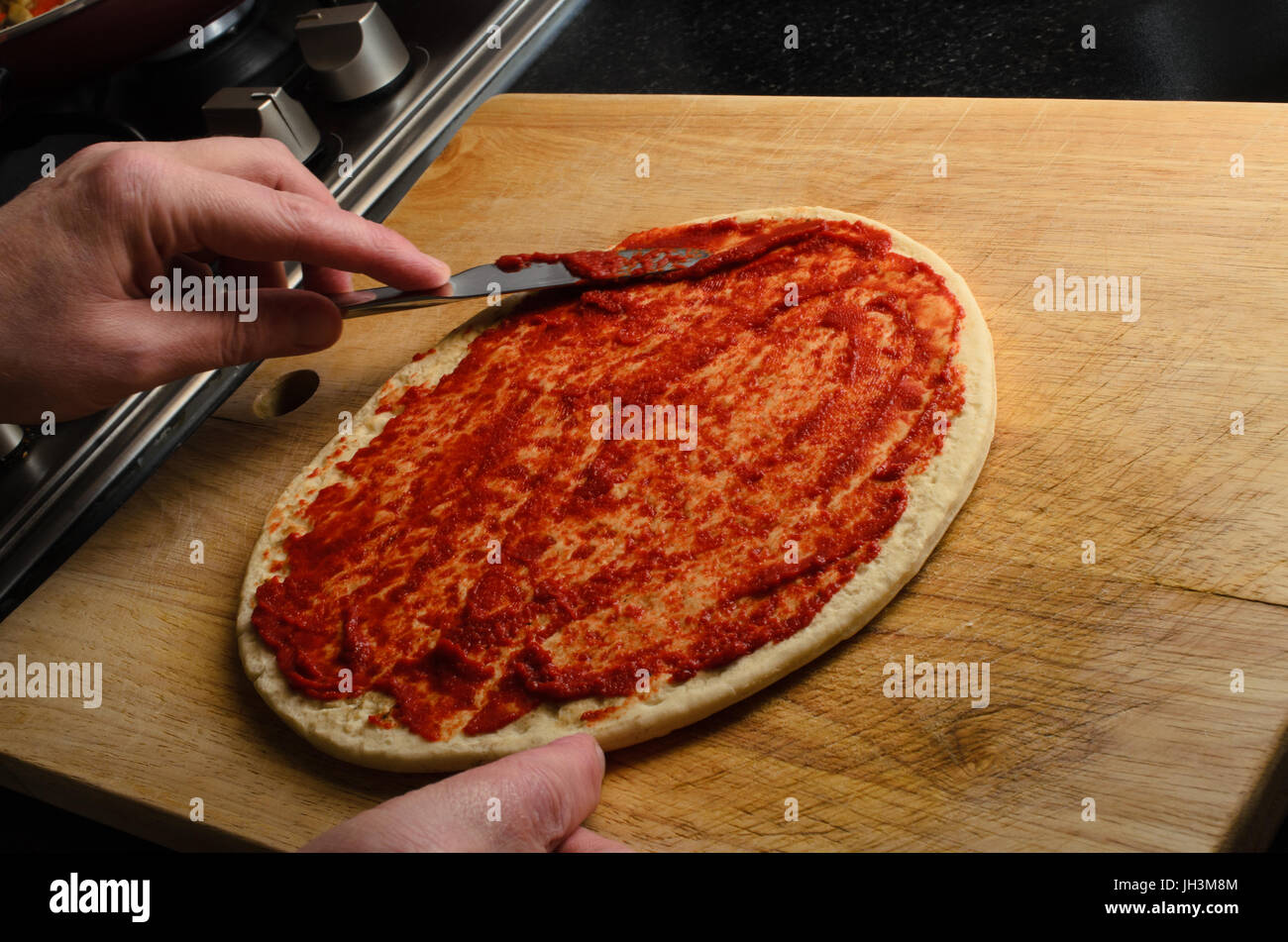 Pizza base tomato sauce hi-res stock photography and images - Alamy