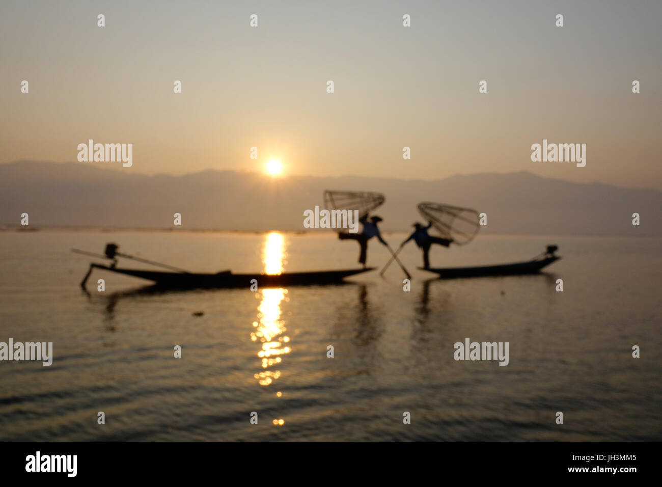 Intha fishermen use the unique methods of rowing and catching fish on ...