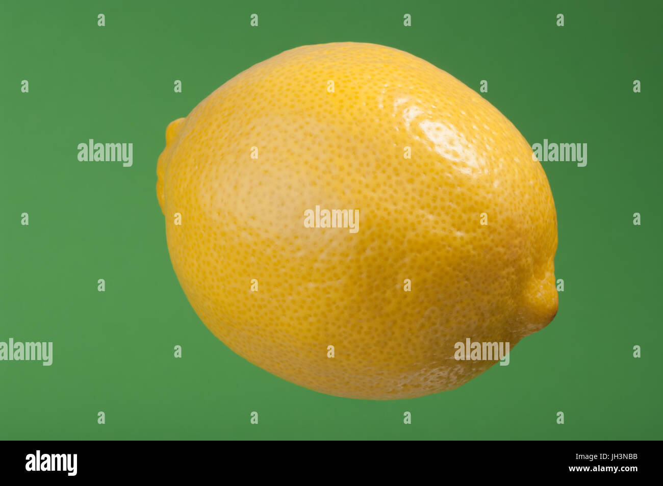 Lemon isolated on green background. Studio Shoot Stock Photo - Alamy