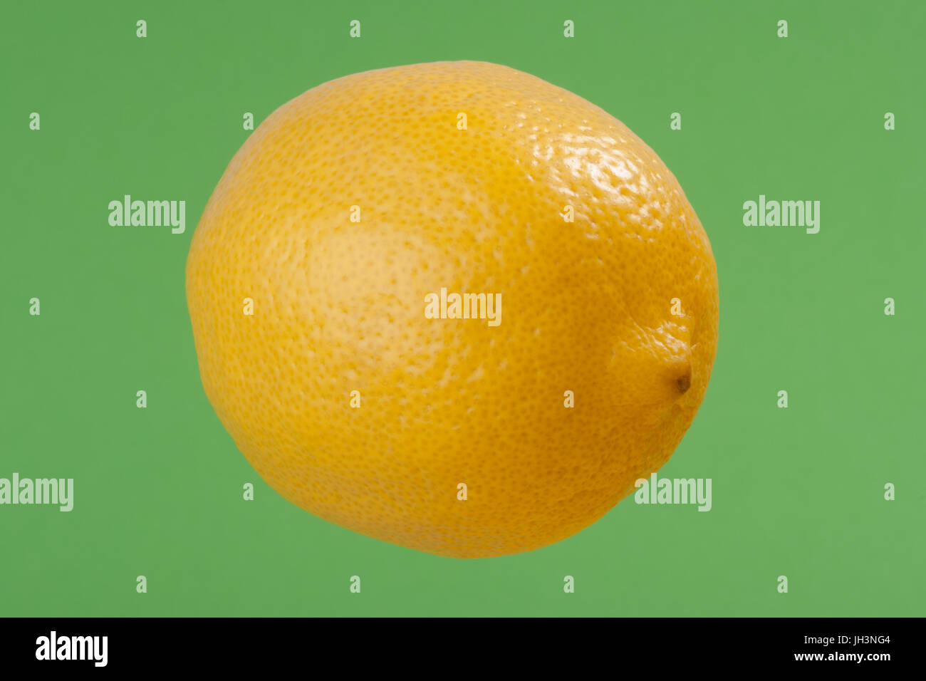 Lemon isolated on green background. Studio Shoot Stock Photo - Alamy