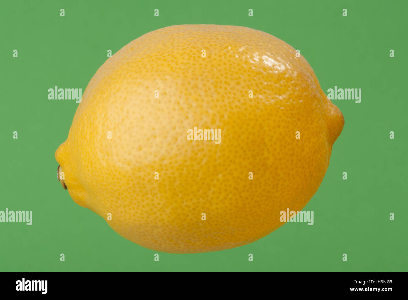 Lemon isolated on green background. Studio Shoot Stock Photo - Alamy