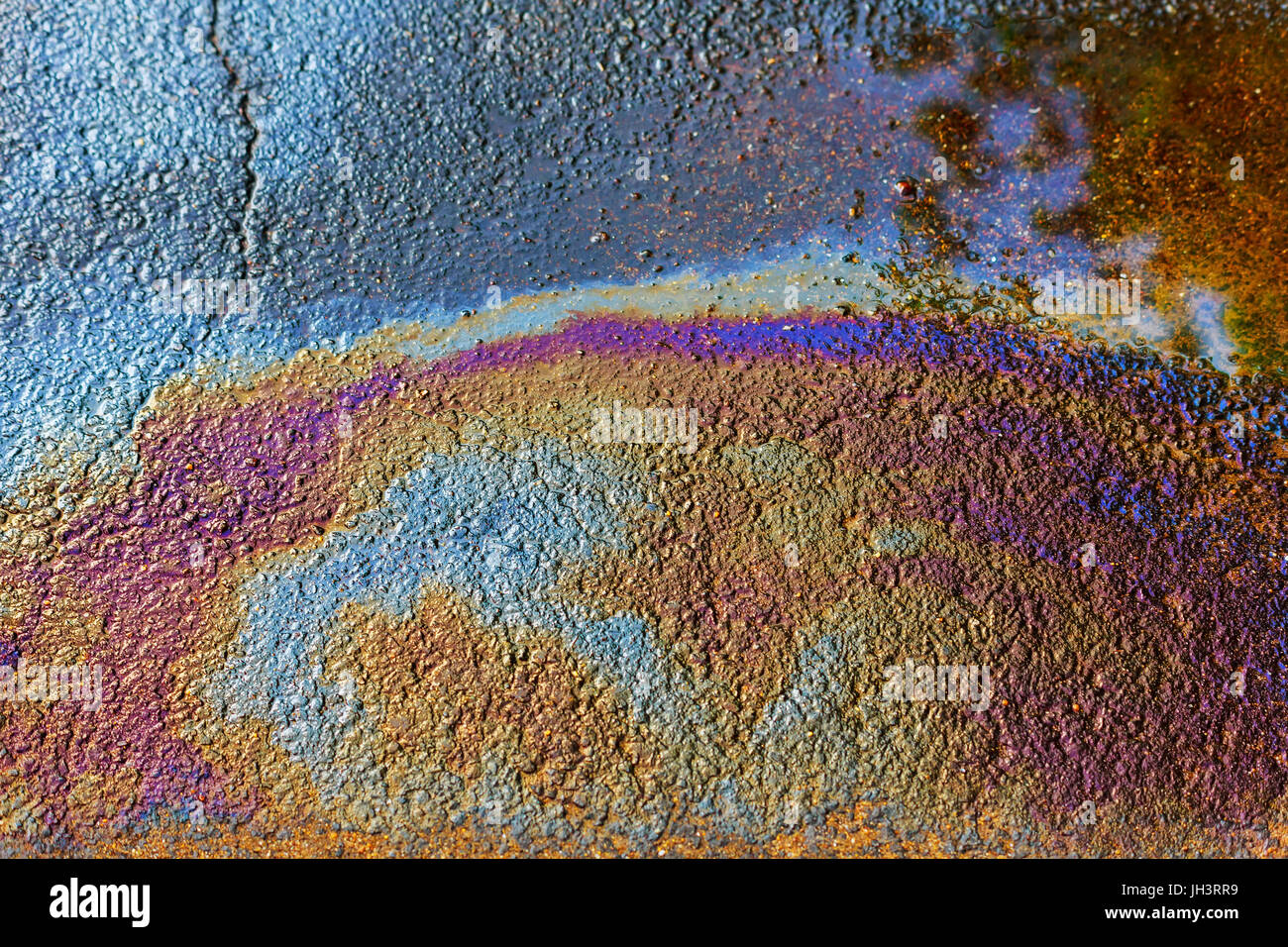 Background of an oil slick on the road. Oil slick on the road Stock ...