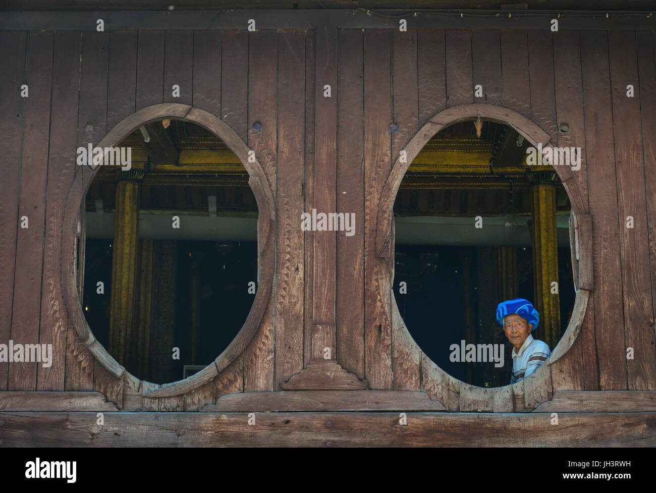 Nyaungshwe, Myanmar - Feb 6, 2017. Burmese man sitting at the wooden ...