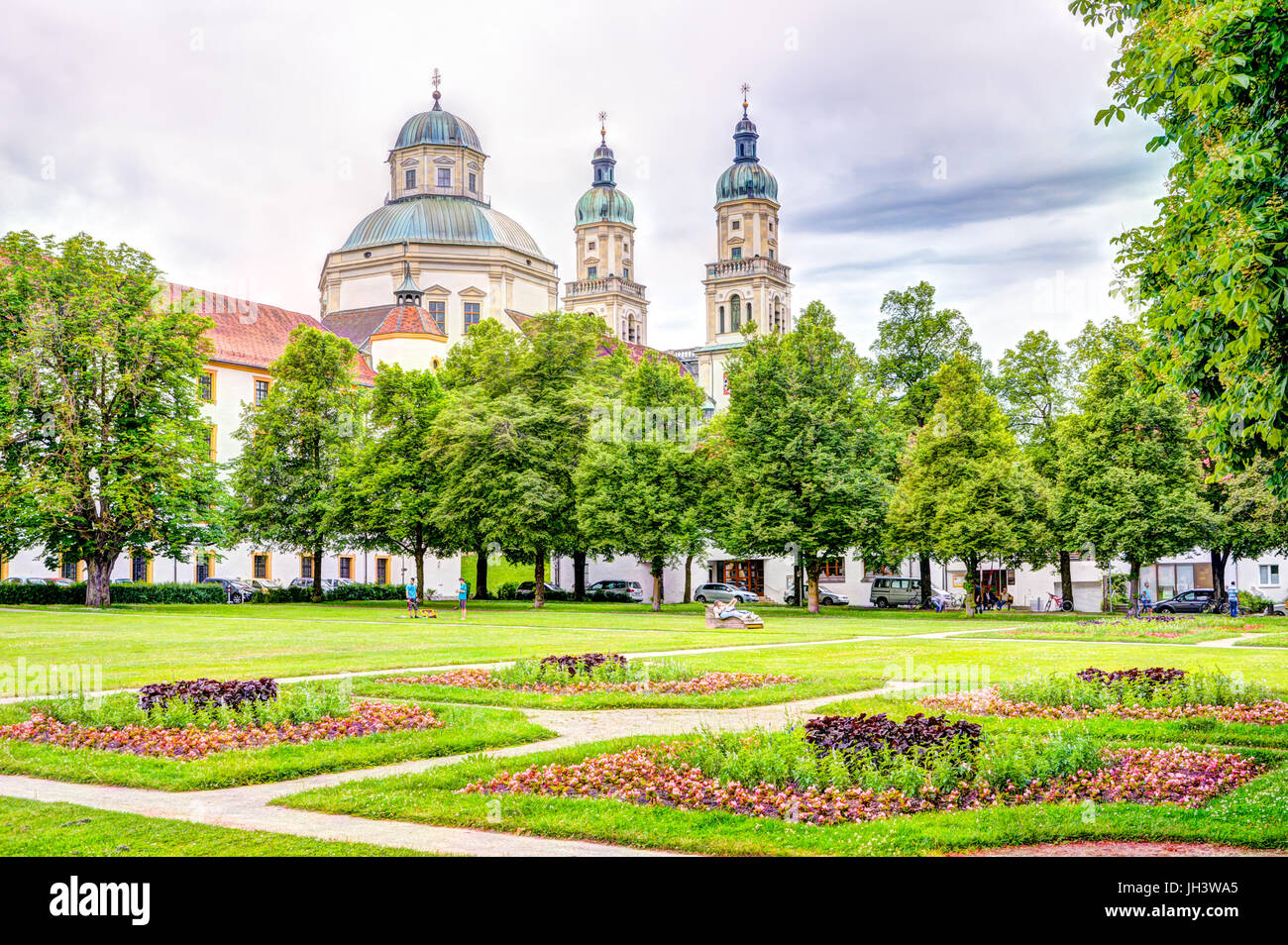 KEMPTEN, GERMANY - JUNE 9: People in park at the Basilica of Keptem ...