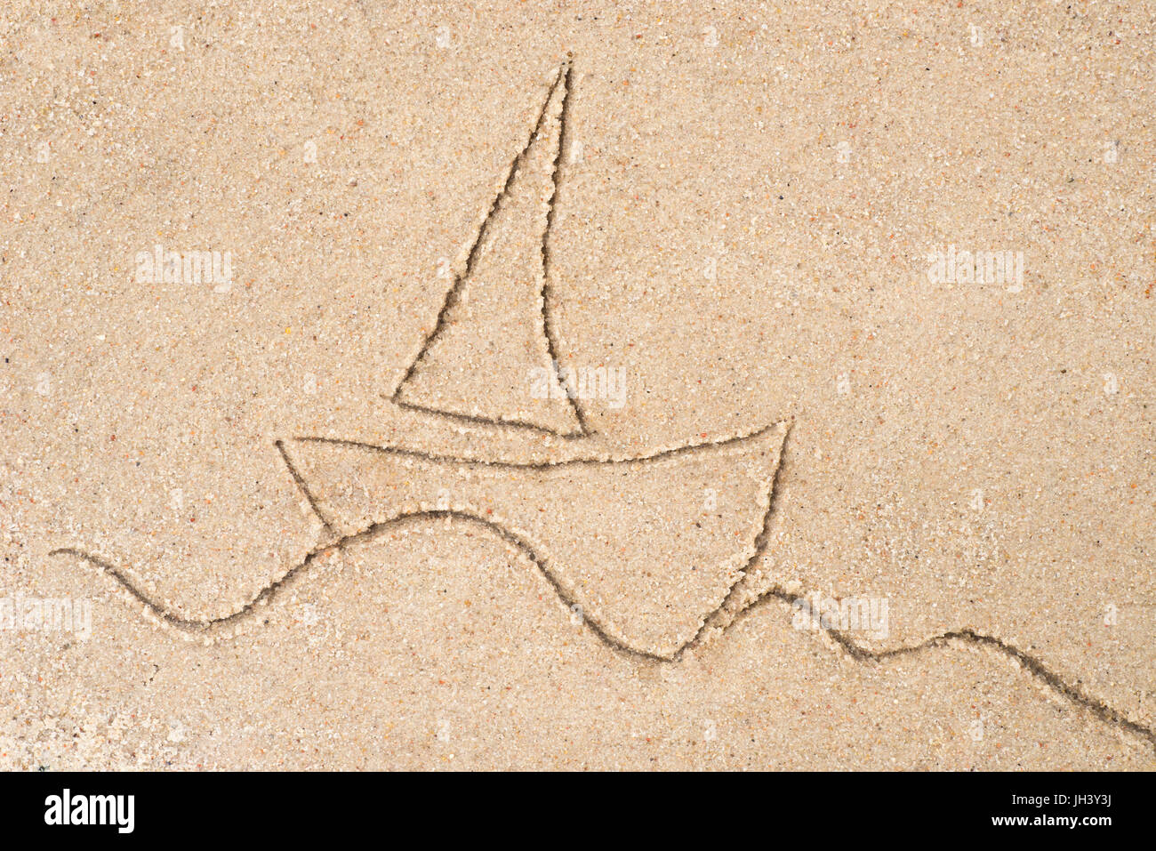 yacht drawing in sand background Stock Photo - Alamy