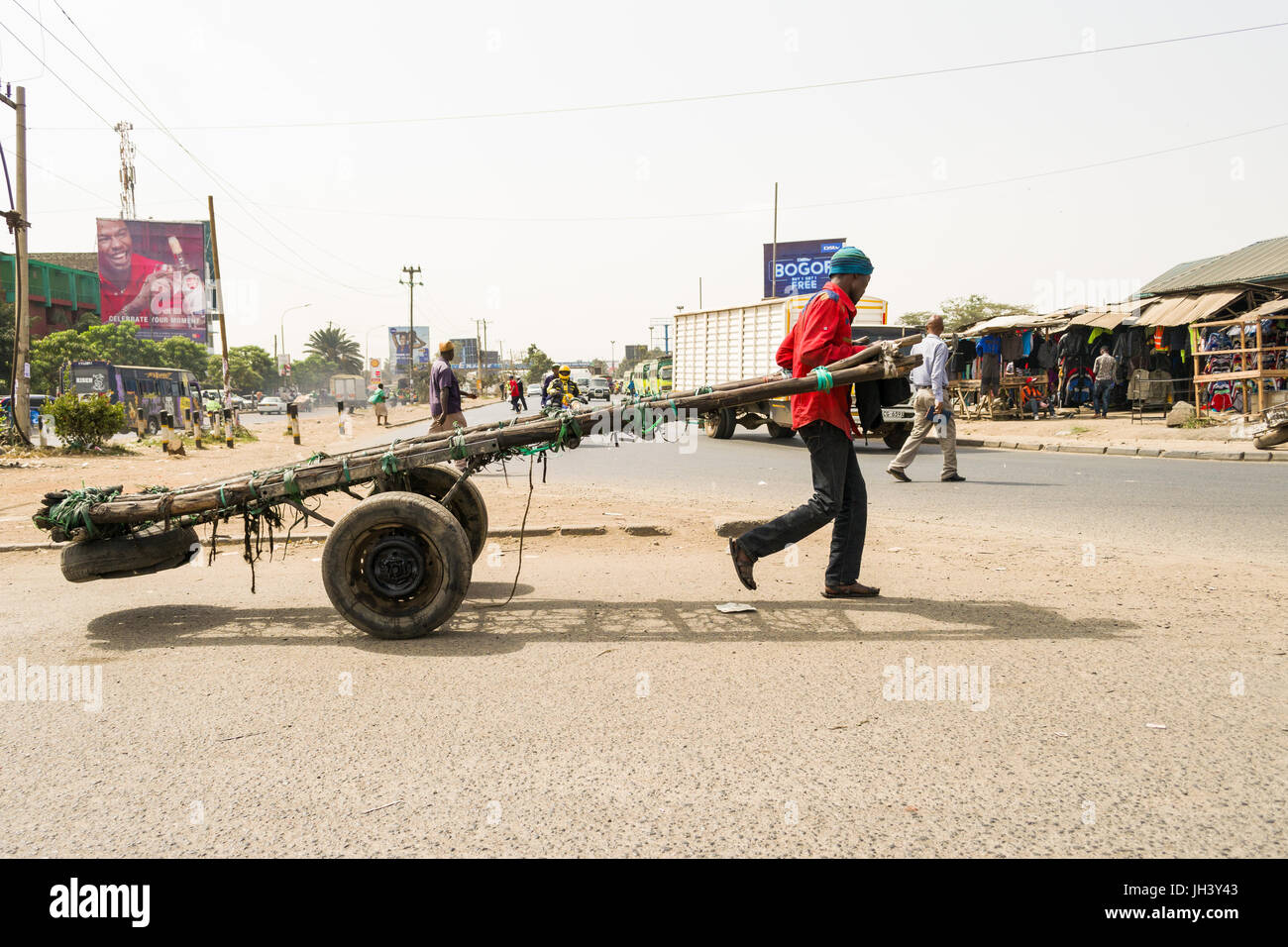 Man pulling cart hi-res stock photography and images - Alamy