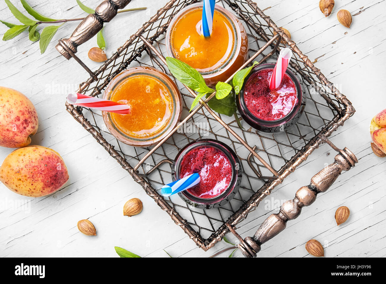 apricot and berry smoothies in a stylish metal basket Stock Photo - Alamy