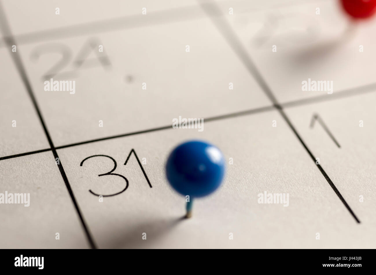 Close up shot of a calendar with a pin on the number 31 Stock Photo - Alamy