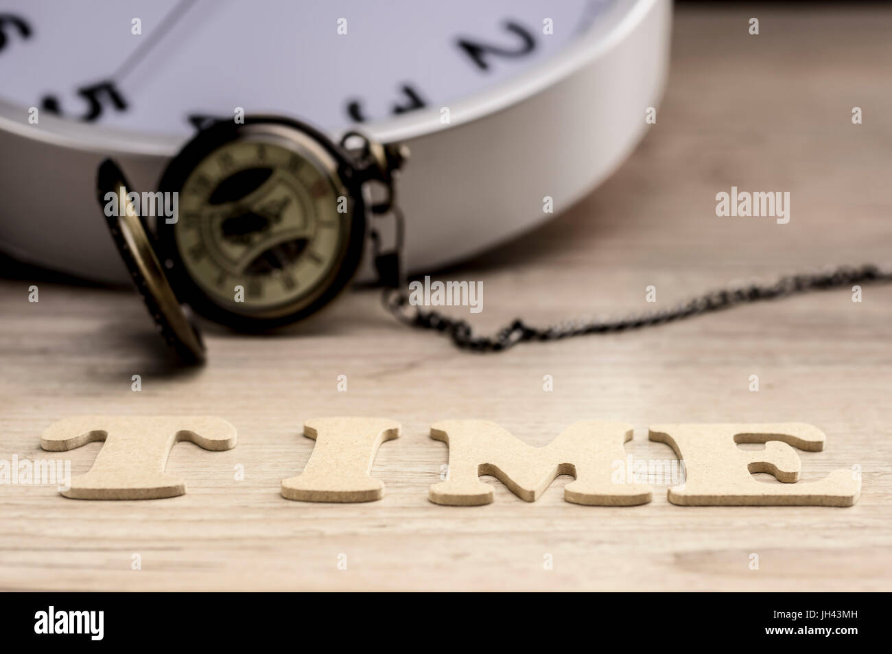 Word time assembled with alphabet letters and watch Stock Photo - Alamy