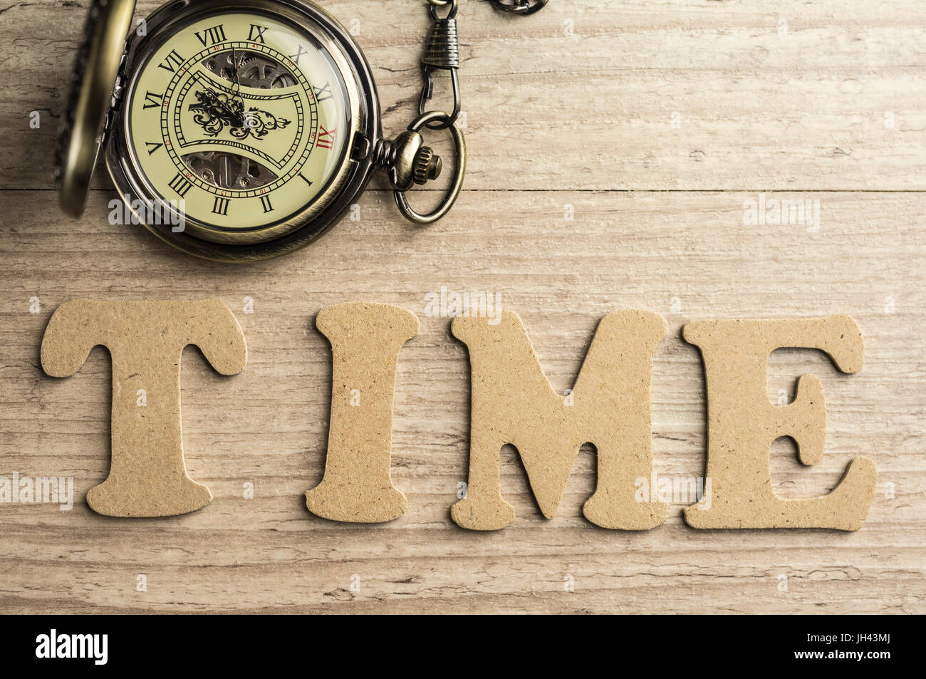 Word time assembled with alphabet letters and watch Stock Photo - Alamy
