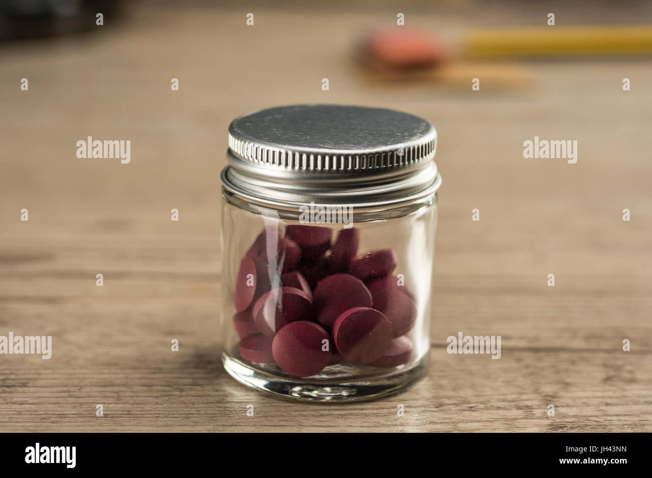 Iron Supplement pills in glass and metal container Stock Photo - Alamy