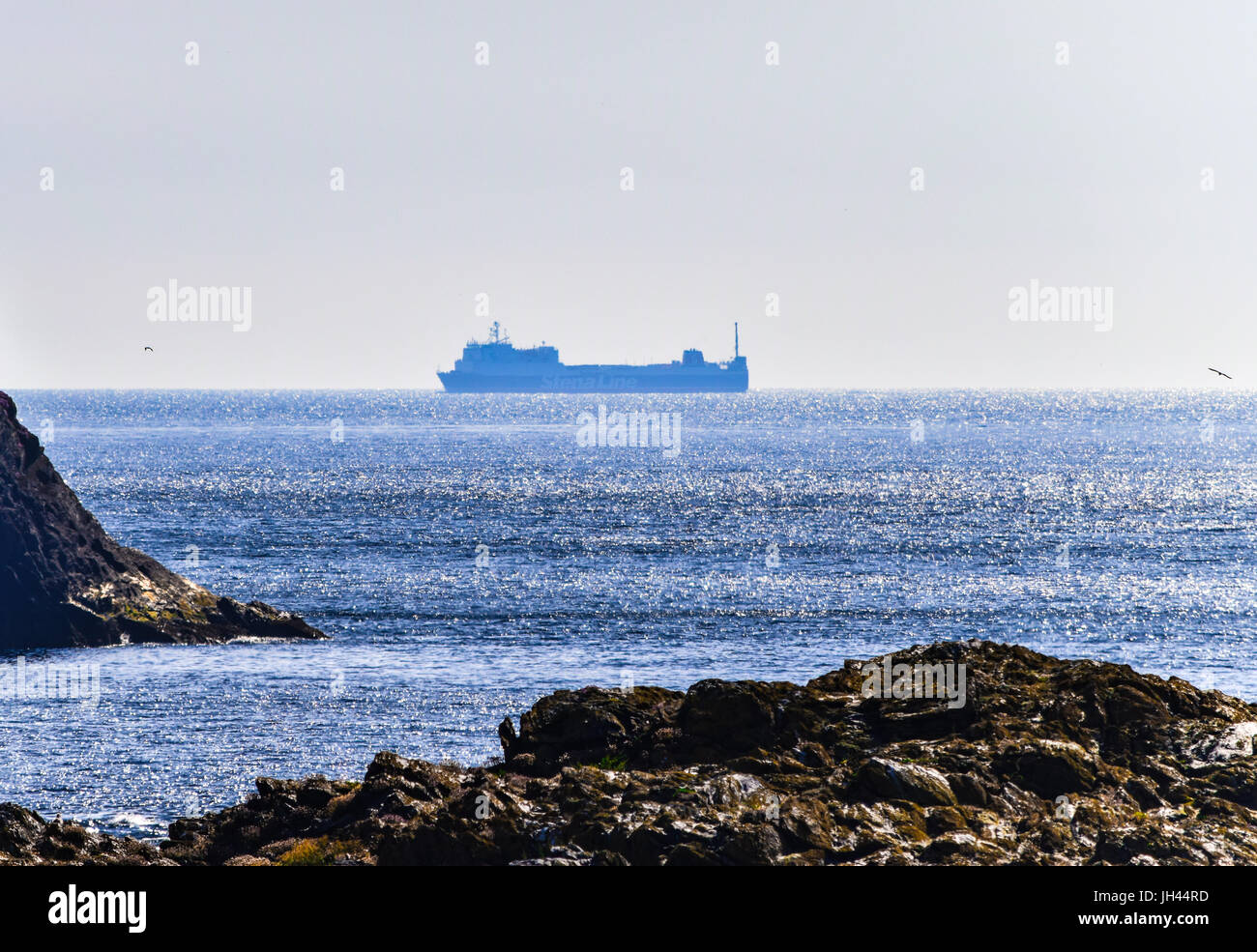Sea view with large ship in the distance at Calf Of Man Stock Photo - Alamy