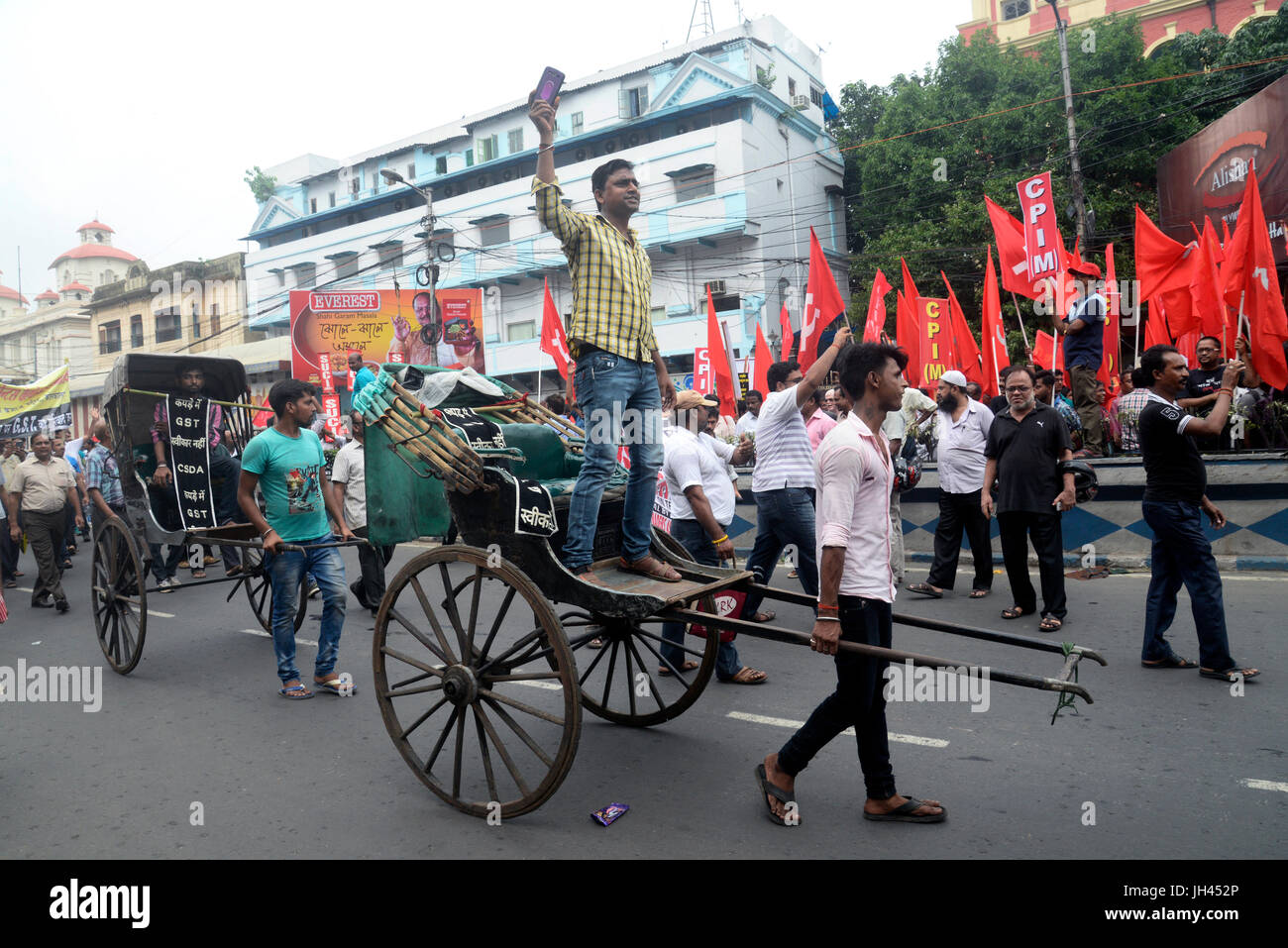 Textile Industries worker rallied with hand pulling rickshaw to show ...