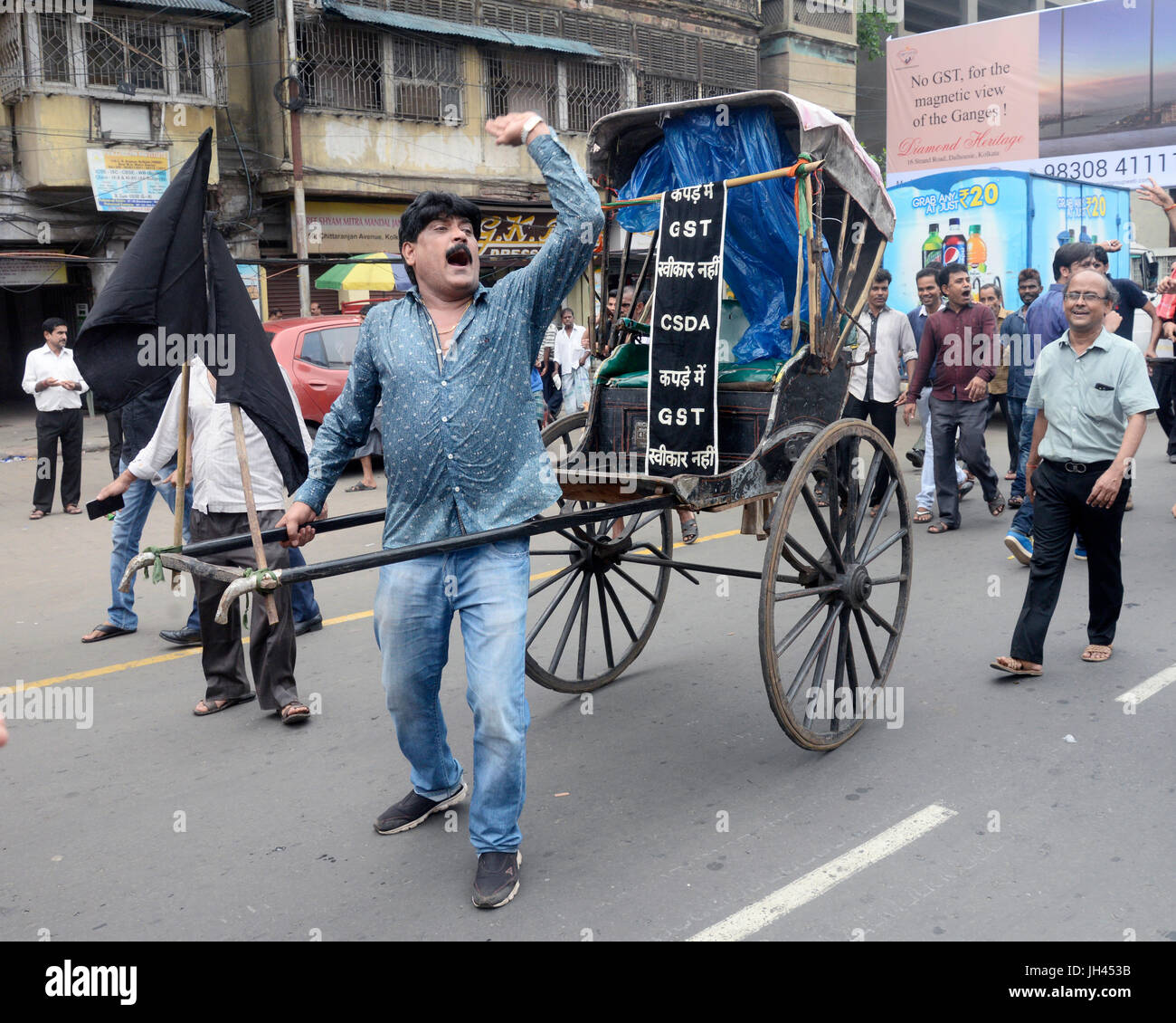 Textile Industries worker rallied with hand pulling rickshaw to show ...