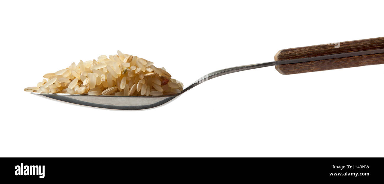 Spoon full of Rice Stock Photo - Alamy