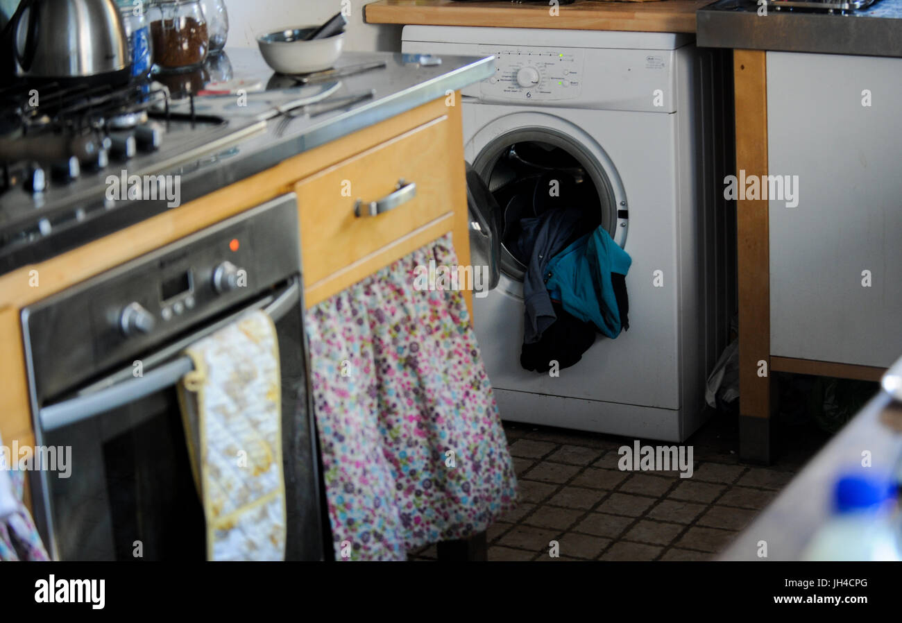 A washing machine pictured in a kitchen Stock Photo - Alamy