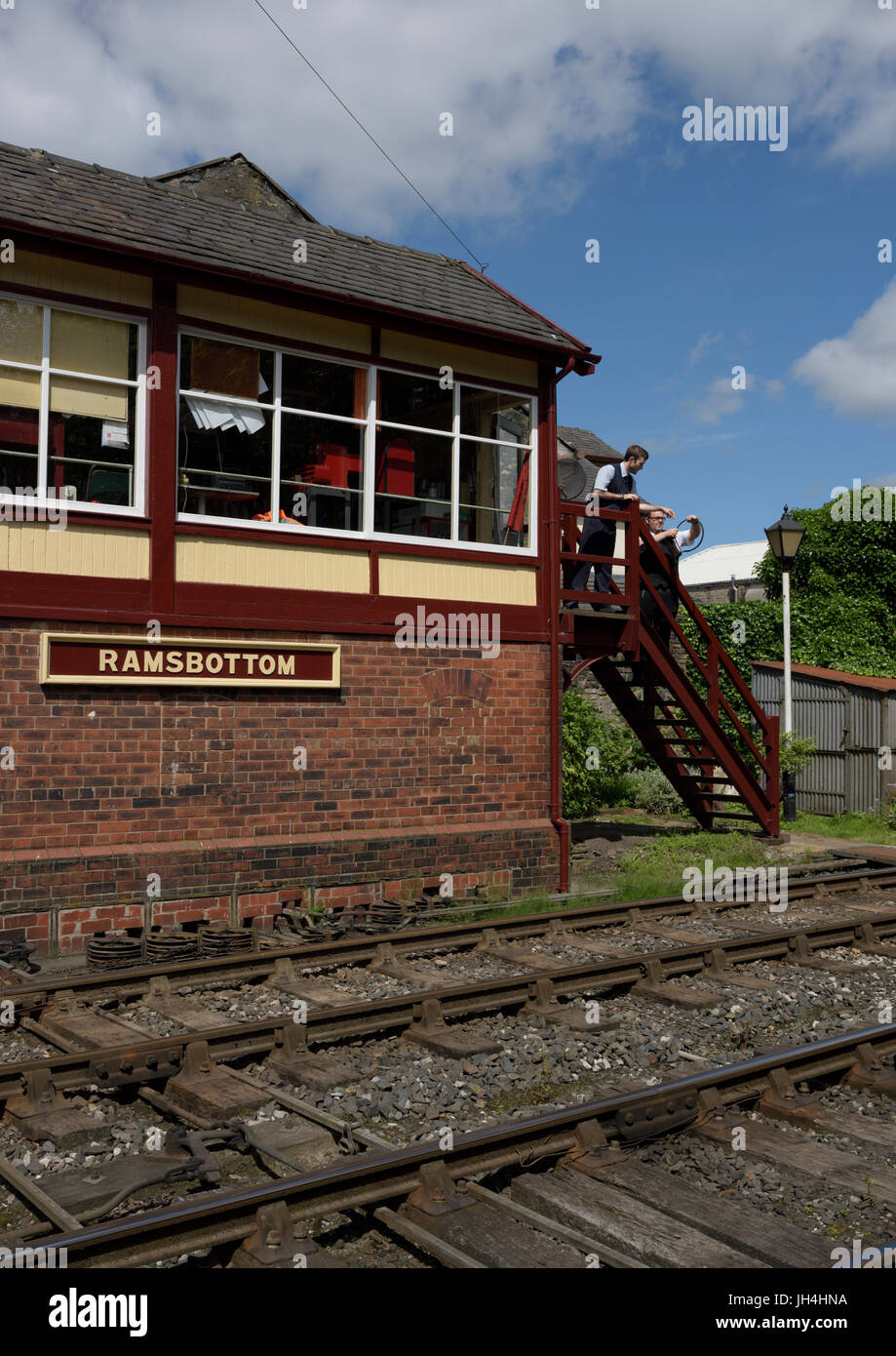 Railway signalman readying token for train on the east lancashire ...