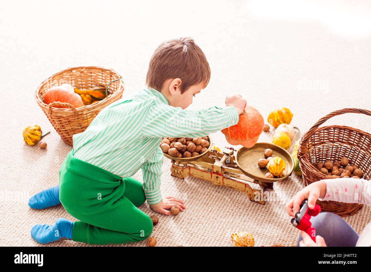 Children in kindergarten playing and exploring the concept of balance ...