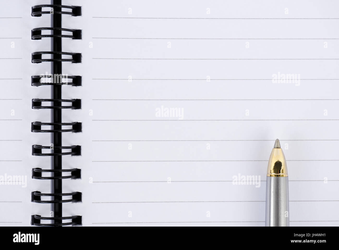Pen and Blank spiral notepad Stock Photo - Alamy