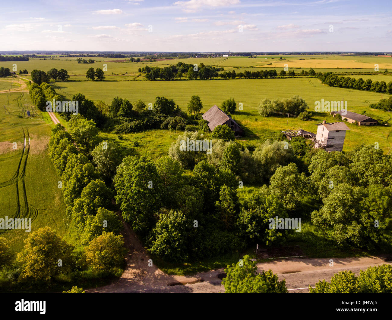 drone image. aerial view of rural area with green fields and forests in ...