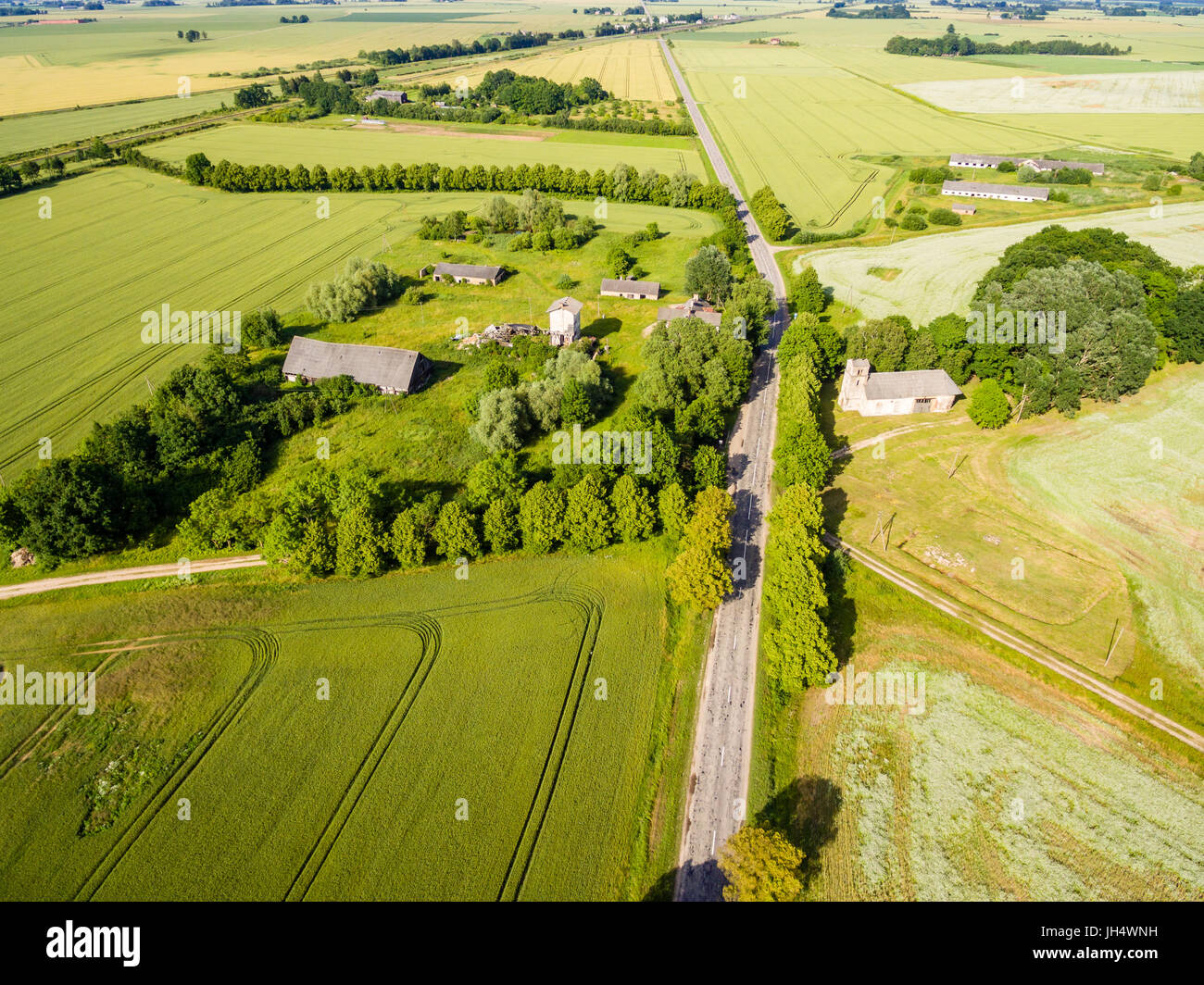 drone image. aerial view of rural area with green fields and forests in ...