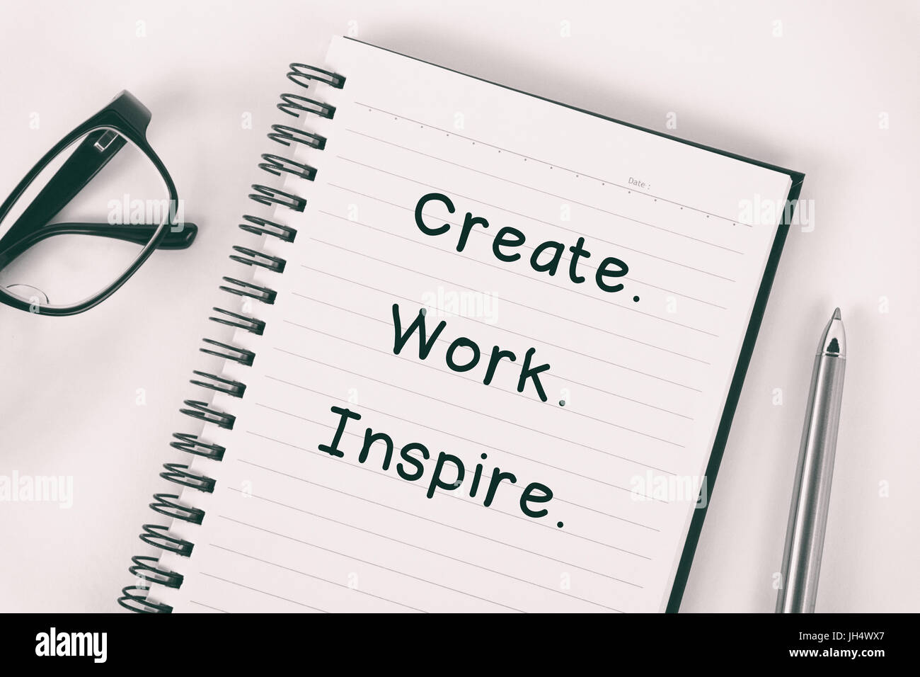 Inspirational quote - Create, work, inspire: written on a note pad with ...