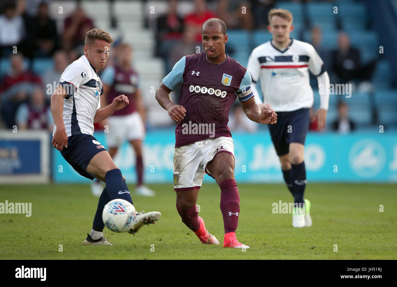 Telford's Kieran Dunbar (left) and Aston Villa's Gabriel Agbonlahor ...