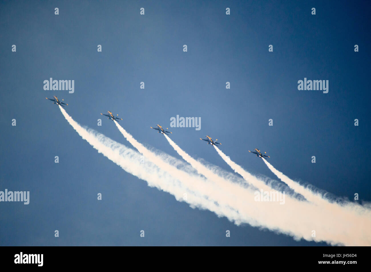 Five blue angel jets flying in formation over their home base in ...