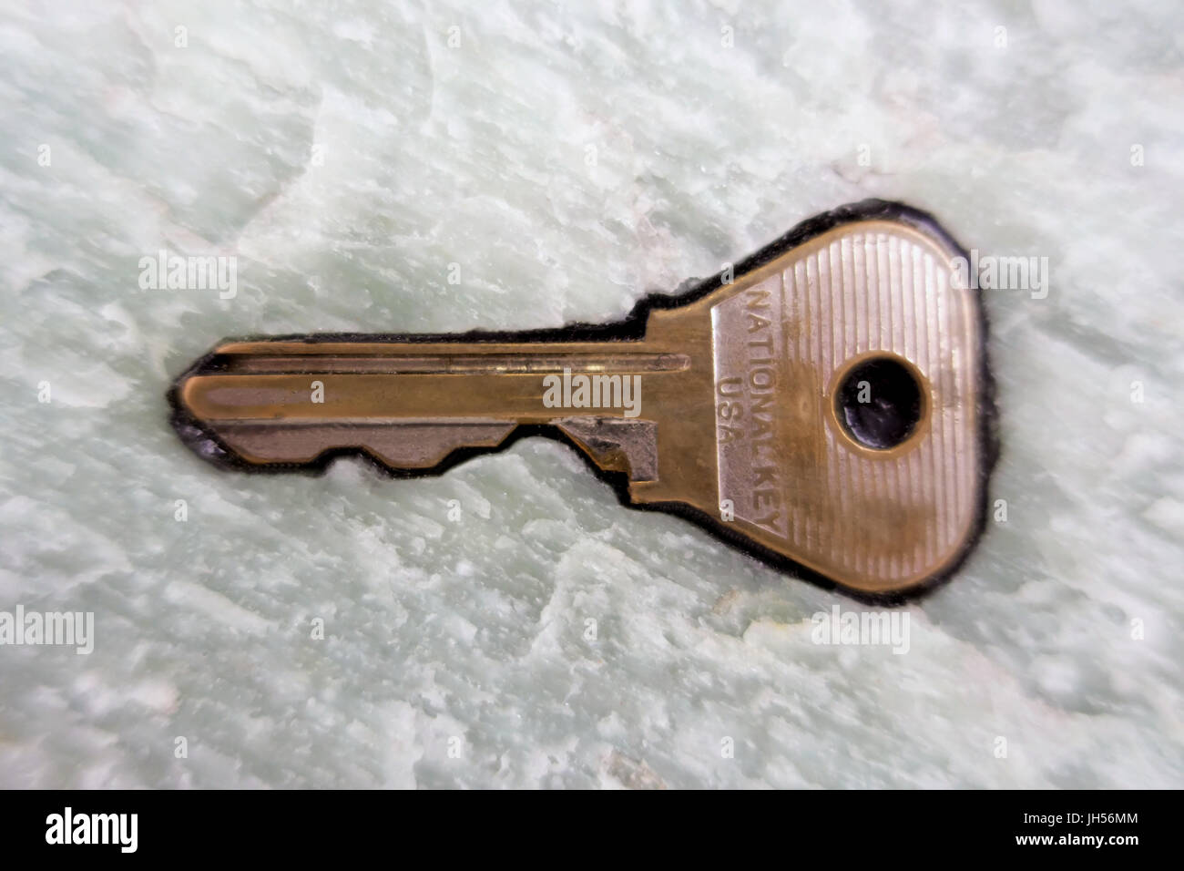 A key set in stone Stock Photo - Alamy