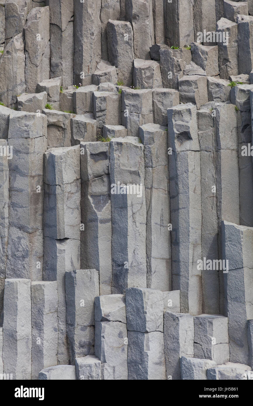 Massive basalt outcrop on the black sand beach at Renisfjara in Iceland ...