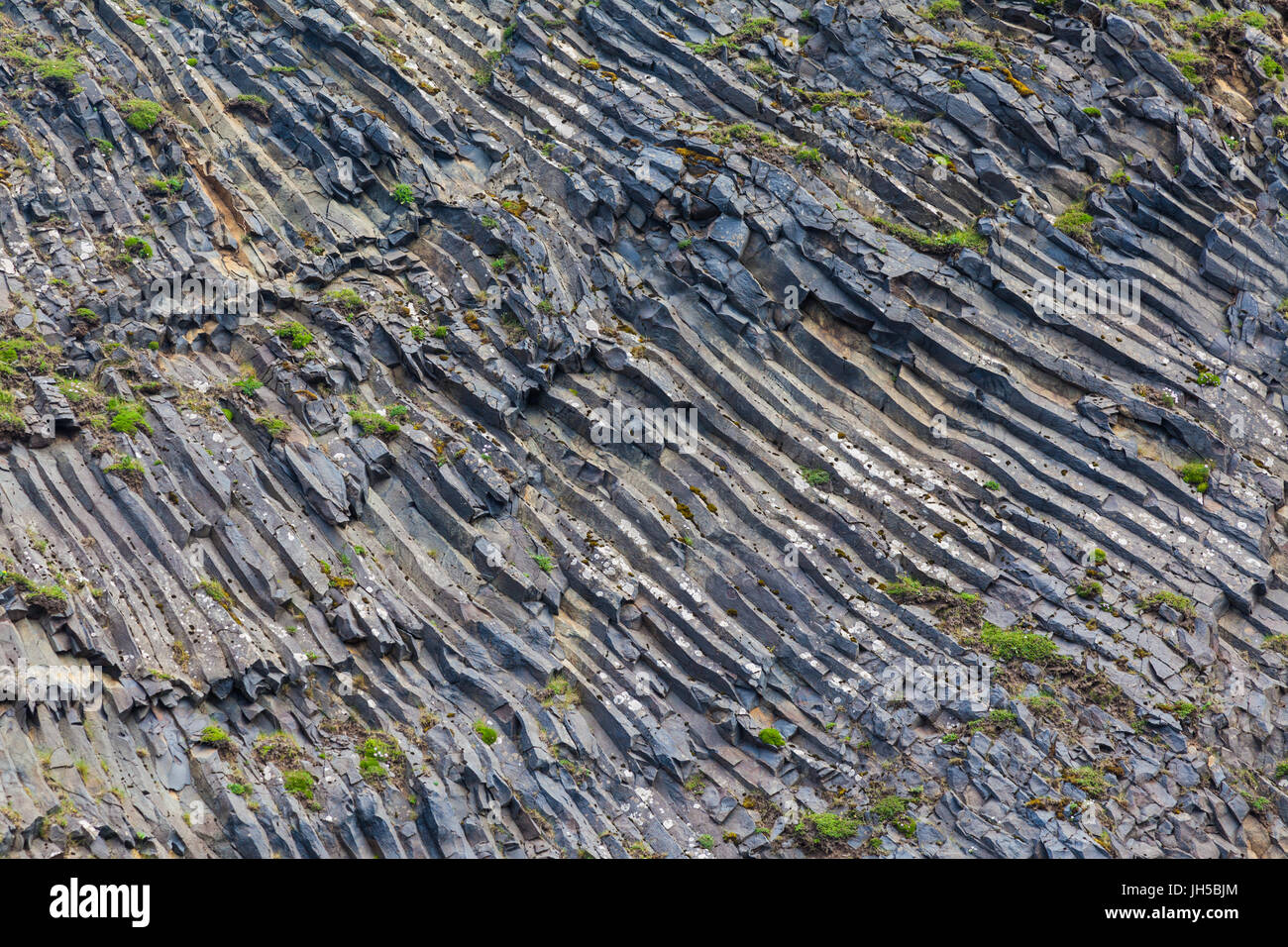 Exposed basalt formations on the Reynisfjara black sand beach in ...