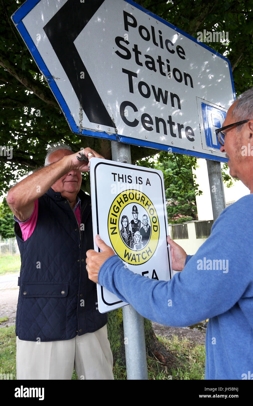 Members of a local Neighbourhood Watch pictured installing a sign in a ...