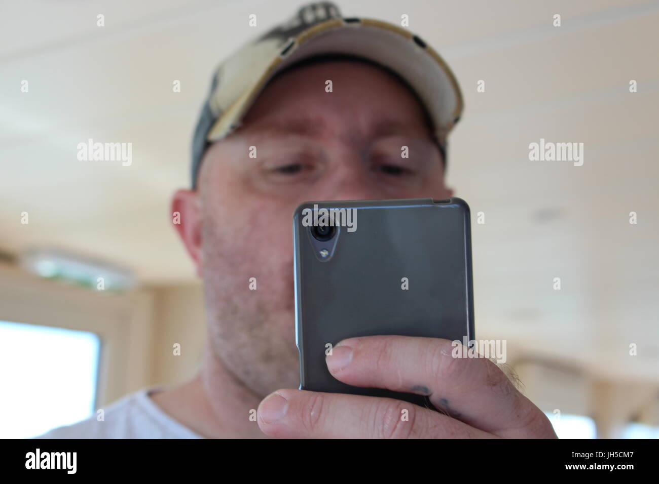 man holding phone, man taking pictures on phone, mobile phone ...