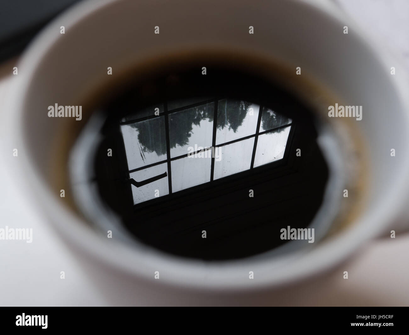 Reflection of window in coffee cup Stock Photo - Alamy