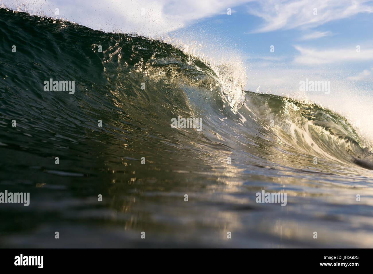 Breaking wave illuminated sunrise hi-res stock photography and images ...