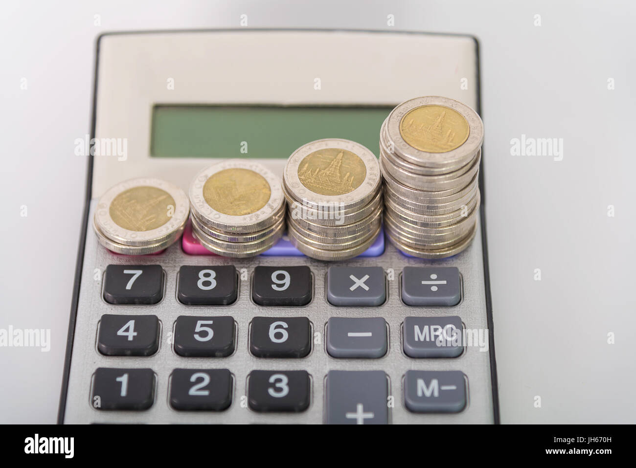 Savings, increasing columns of coins, piles of coins arranged as a ...
