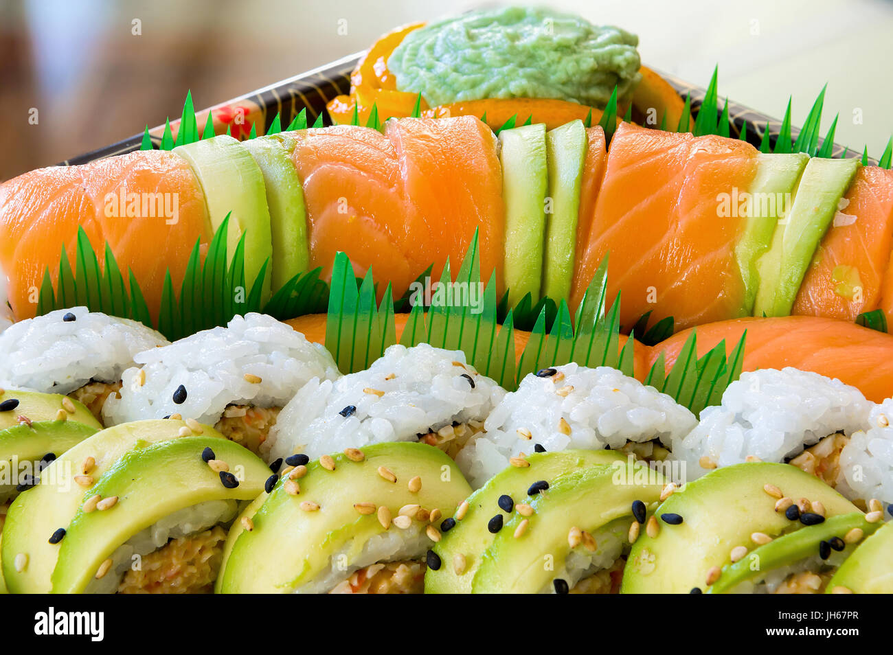 Sushi Roll Platter with Raw Salmon Avocado Cream Cheese Platter Closeup ...