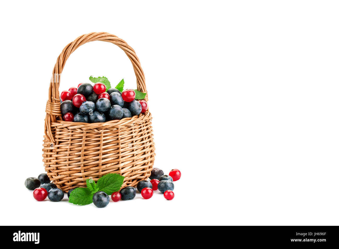 Fresh berries in basket isolated on white background Stock Photo - Alamy