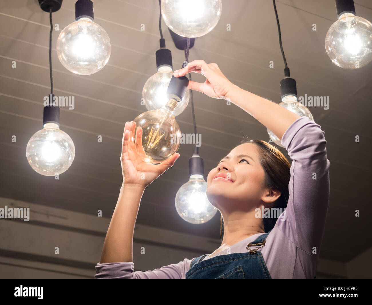 Changing light bulb hi-res stock photography and images - Alamy