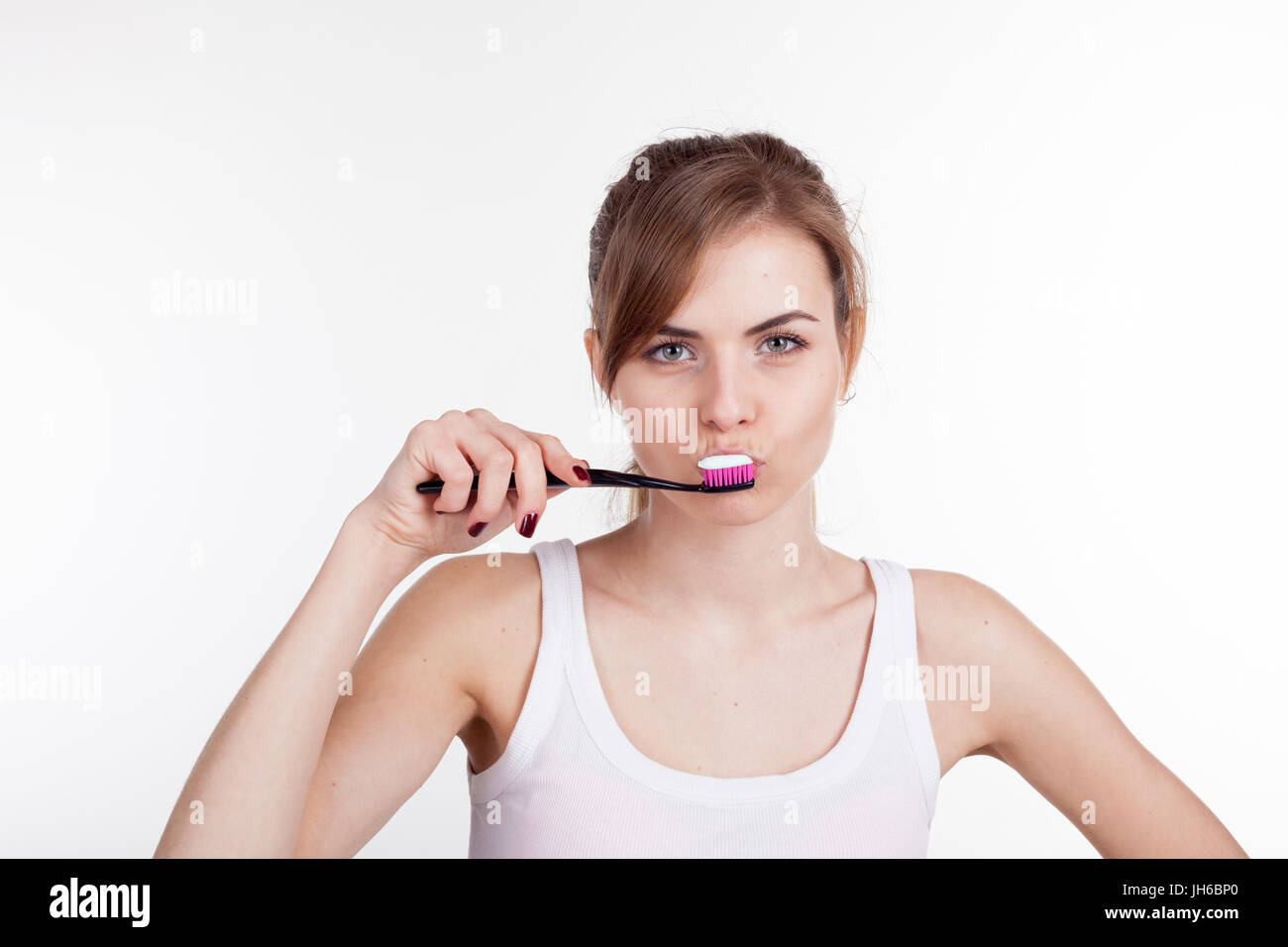 girl holding a toothbrush dentistry Stock Photo - Alamy