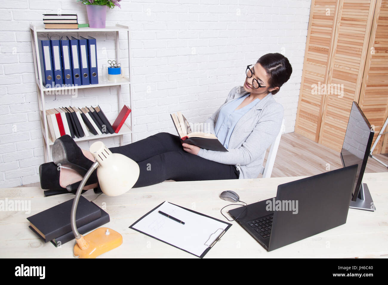 the business Secretary girl works at the computer Stock Photo - Alamy