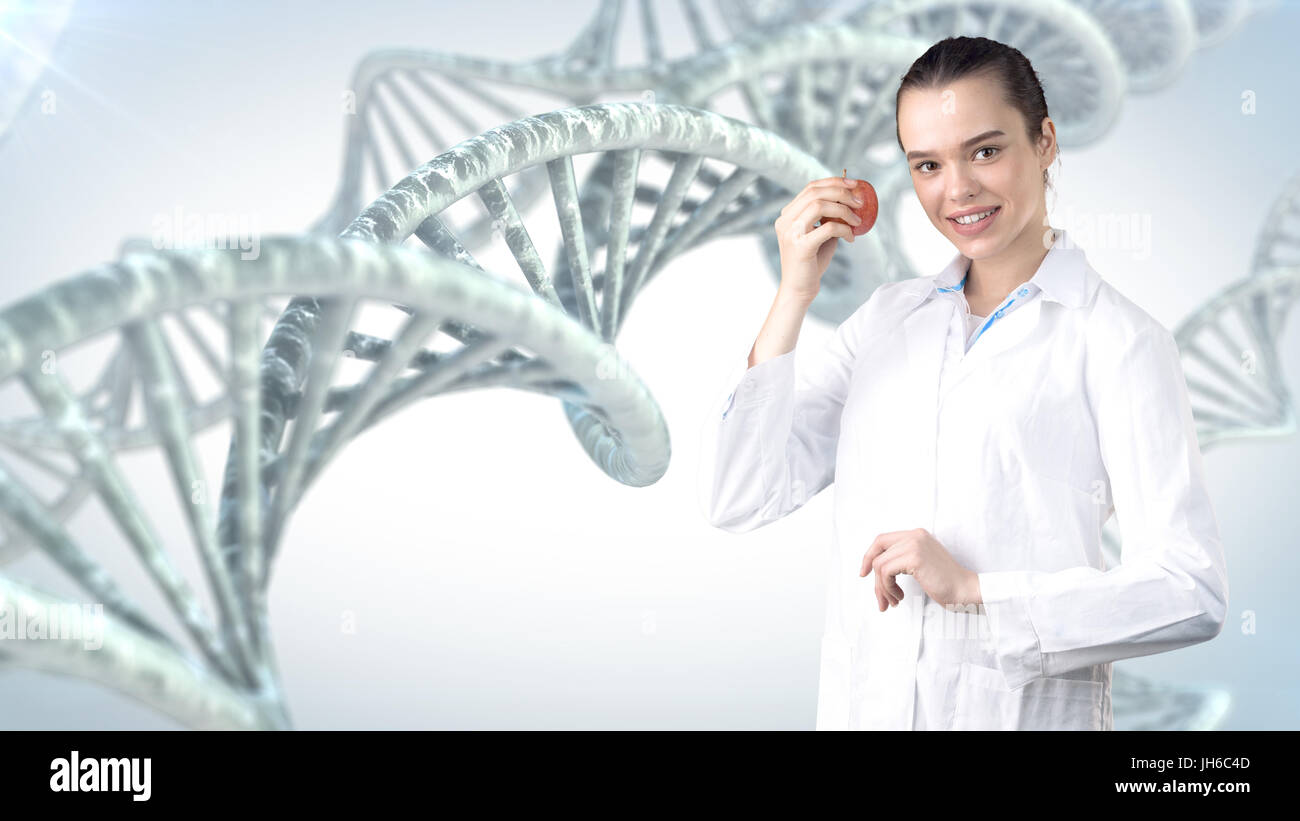 Beautiful medical woman doctor in uniform. Studio painted background ...