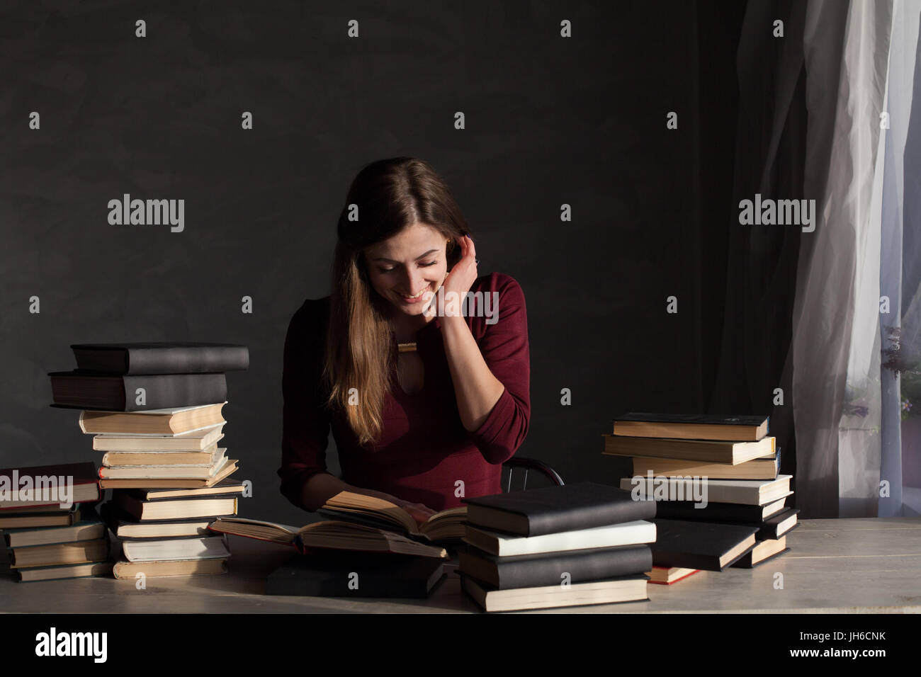 girl reading book prepares for the exam in the library Stock Photo - Alamy