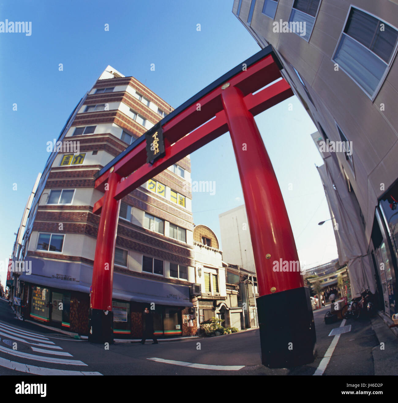 Torii gates on a busy modern city street, Asakusa, Tokyo Stock Photo ...