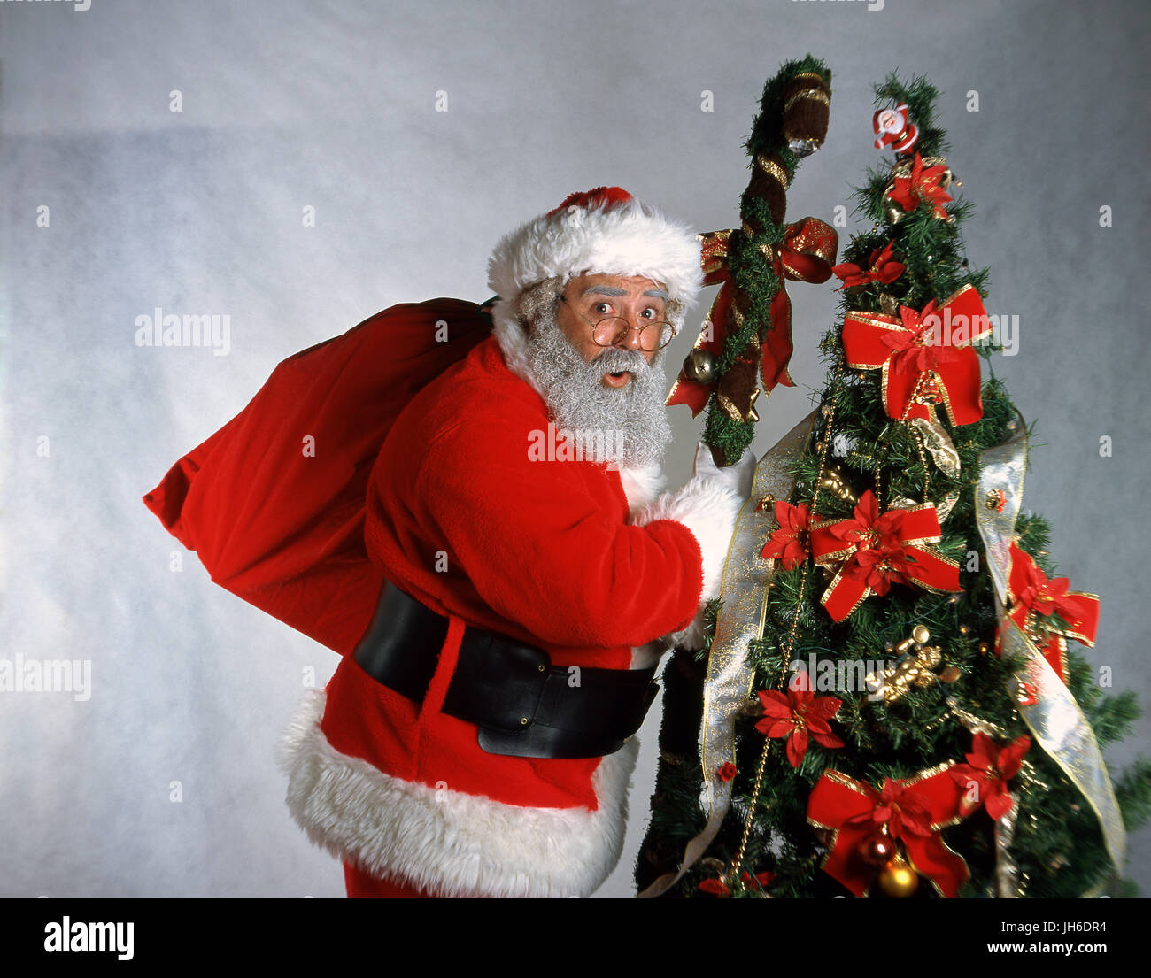 Santa Claus, christmas tree Stock Photo - Alamy