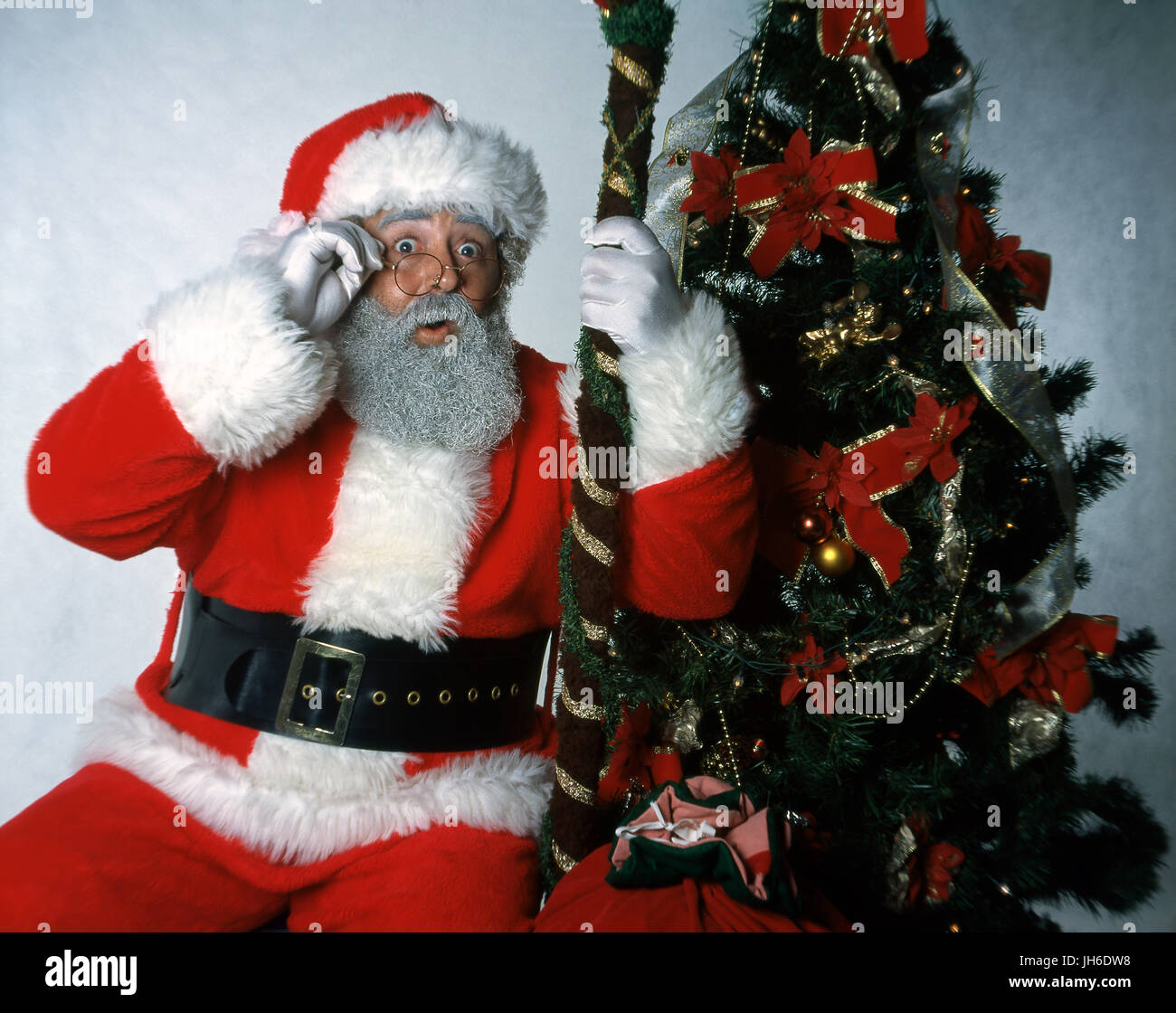 Santa Claus, christmas tree Stock Photo - Alamy