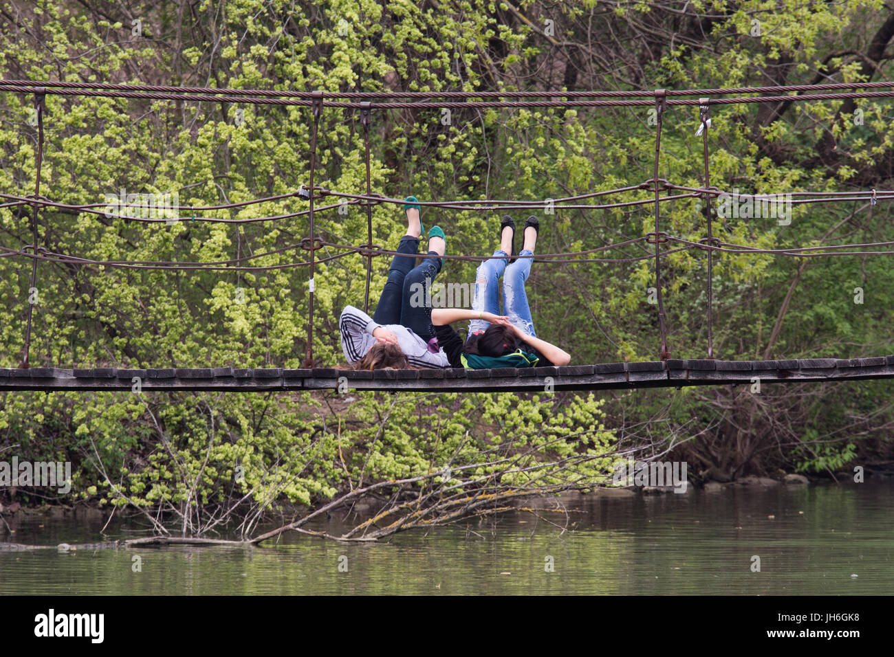 Girls on a bridge Stock Photo - Alamy