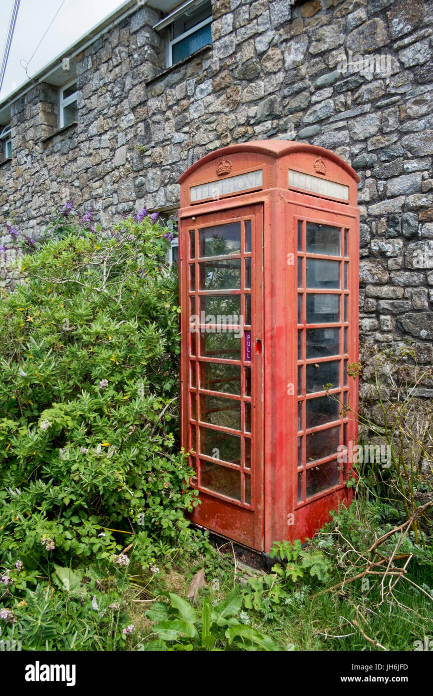 Distressed old style red British phone booth Stock Photo - Alamy
