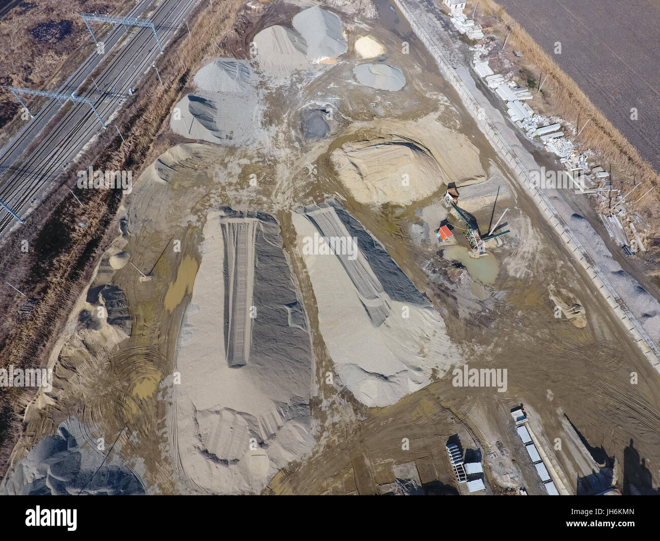 Heaps of rubble and pebbles. for road repair plant. The site with ...