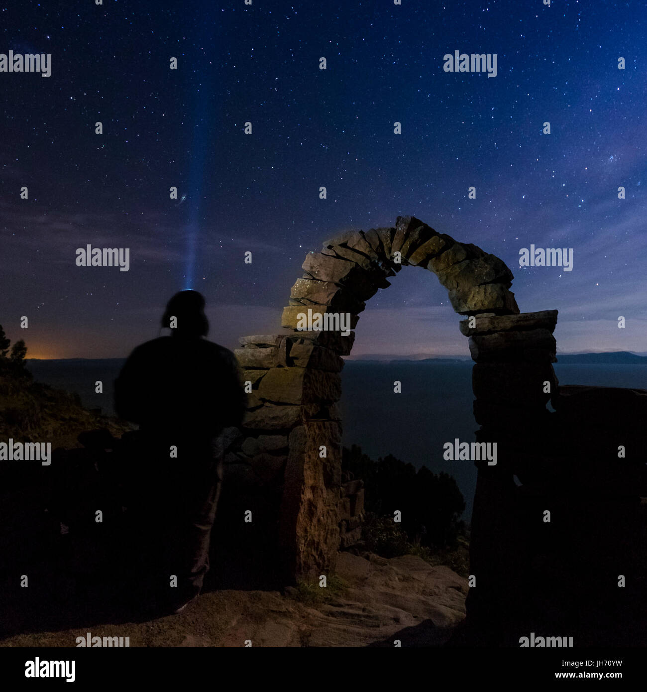 PUNO, PERU - CIRCA OCTOBER 2015: Man looking the sky and stars by a ...